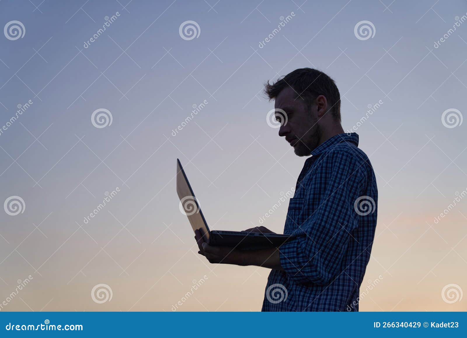 Developer Male in Silhouette Using Laptop Outdoor at Sunset, Working ...