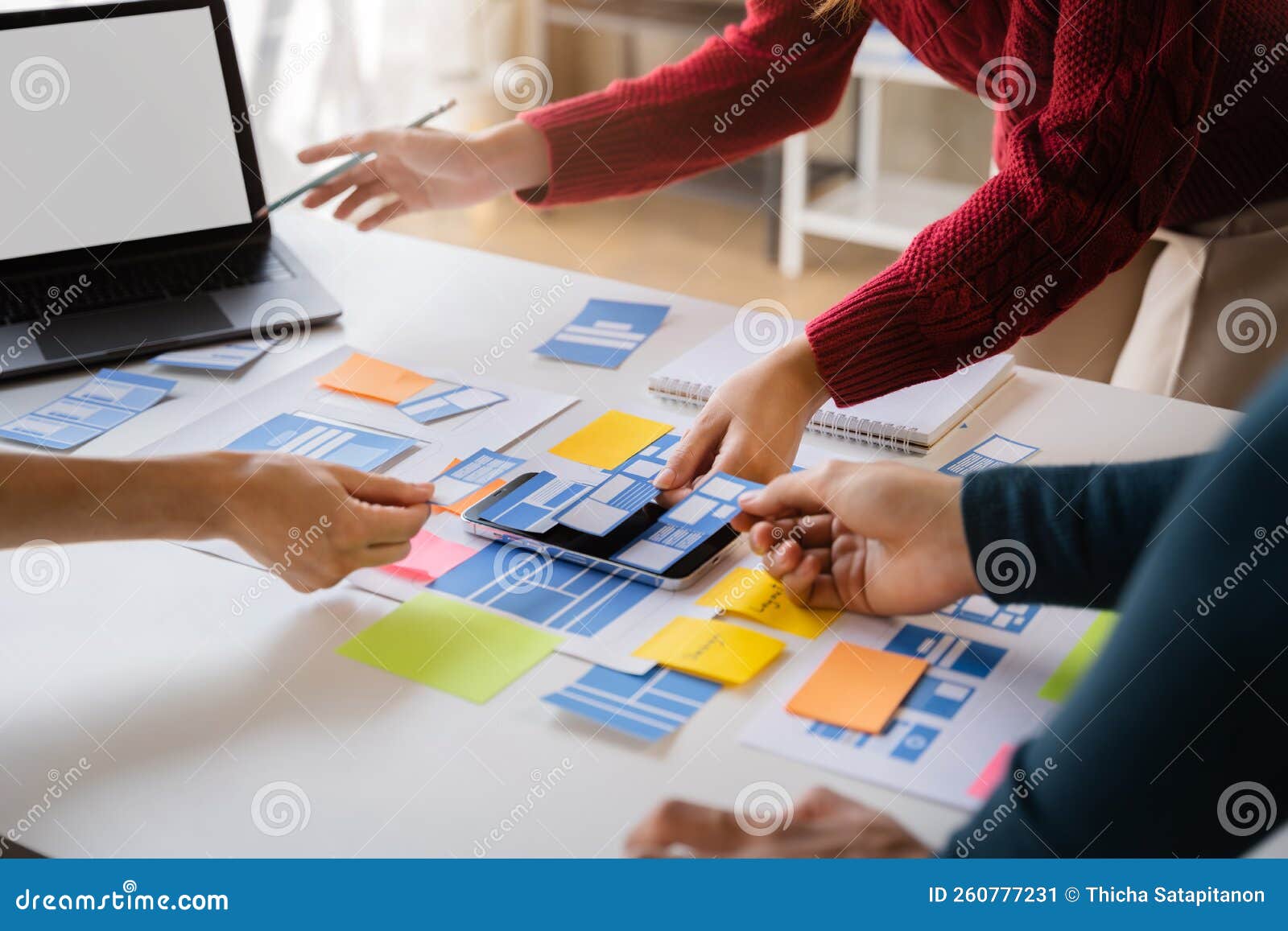 Developer Team Brainstorming on Their Project with Laptop, Smartphone ...