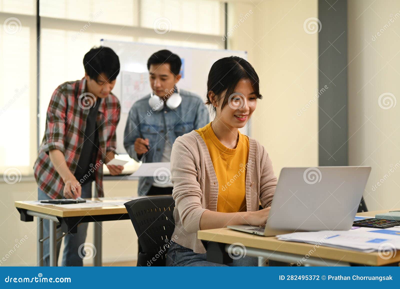 Developer Team Collaborating and Planning Template Layout for Mobile ...