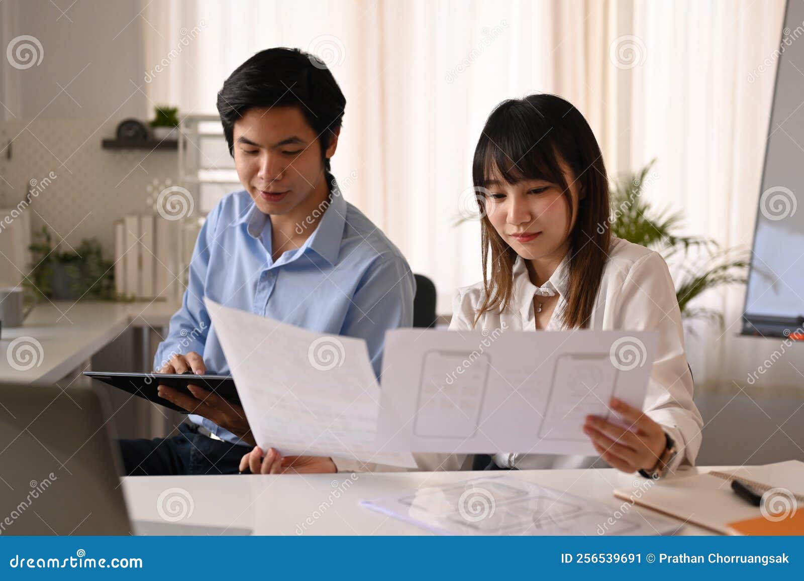 Developer Team Working On Mobile Application Software Design Project Together At Modern