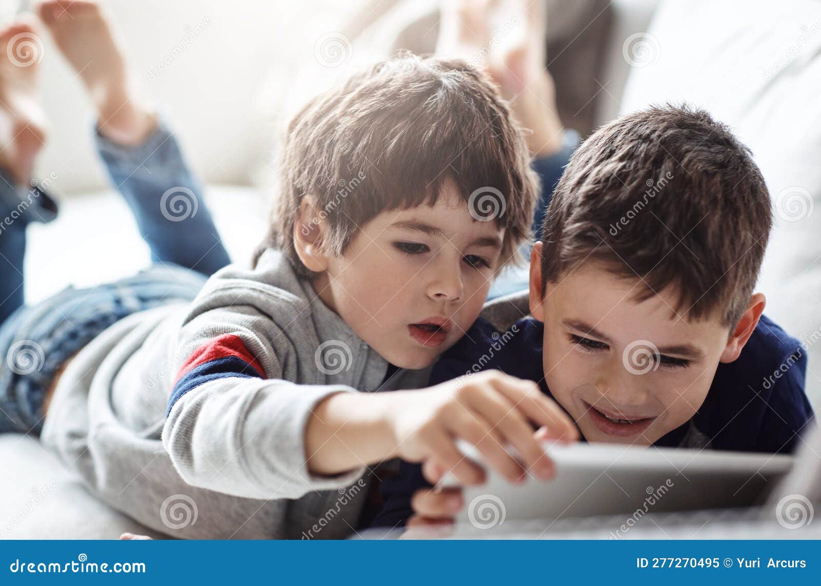Developing Their Digital Tech Savviness. Two Adorable Brothers Using a ...