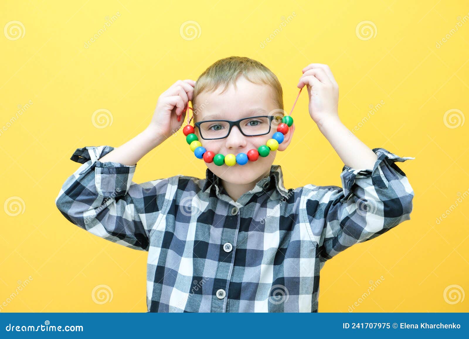 Development of Fine Motor Skills. Toddler Boy is Stringing Beads on a ...