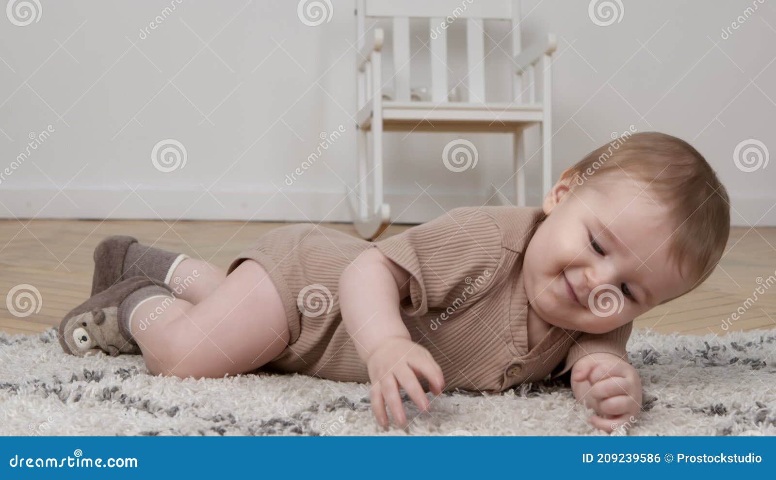 Happy Child Learning To Crawl, Lying on Floor at Home, Slow Motion ...