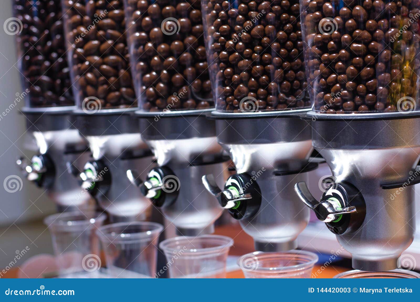 Devices Issuing Small Round Sweets in Chocolate Stock Image - Image of ...