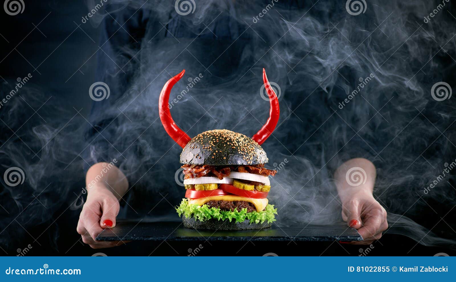 Devil Burger with Bacon and Vegetables on Black Slat Plate Stock Image ...