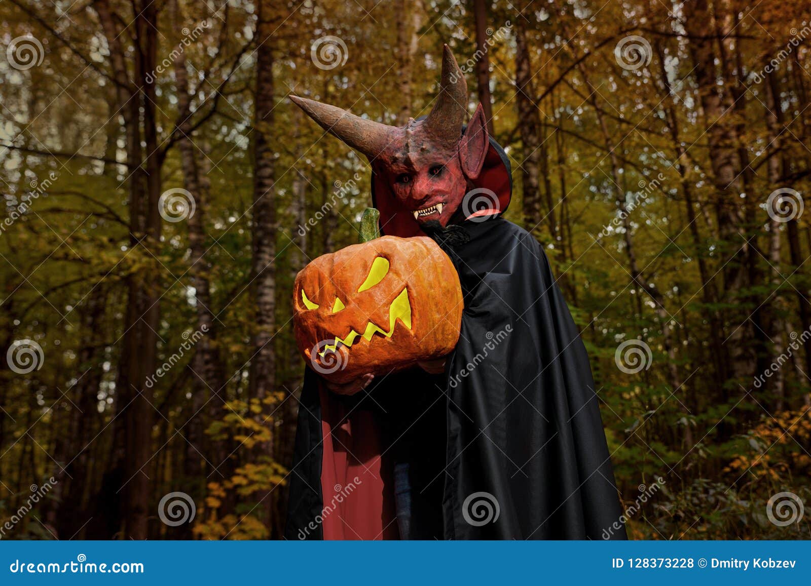 Devil in the Dark Forest with Pumpkin Stock Photo - Image of horns ...