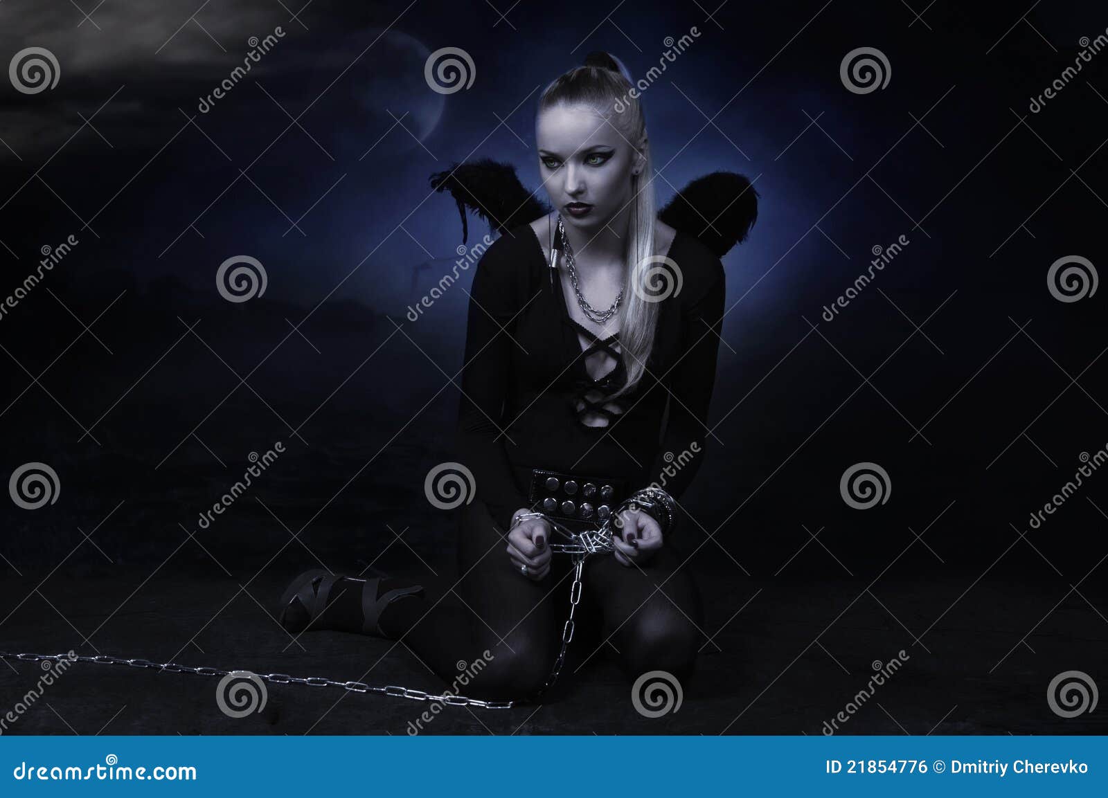 Devil girl in a chains stock photo. Image of dress, long - 21854776