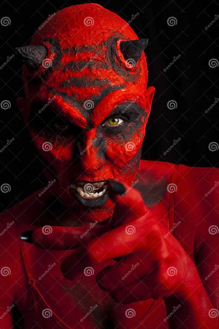 Devil pointing at you. stock photo. Image of beautiful - 20831098