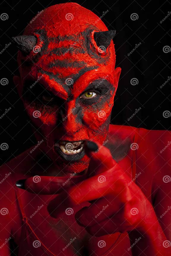 Devil pointing at you. stock photo. Image of beautiful - 20831098