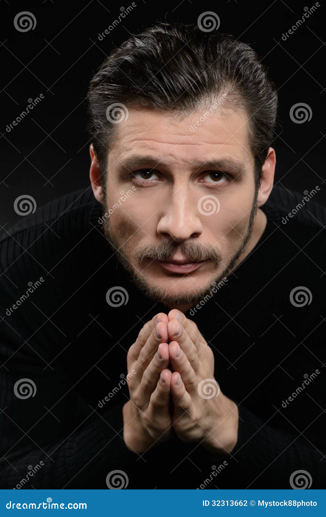 Devout Man Praying. Devout Bearded Man Praying and Holding His H Stock ...