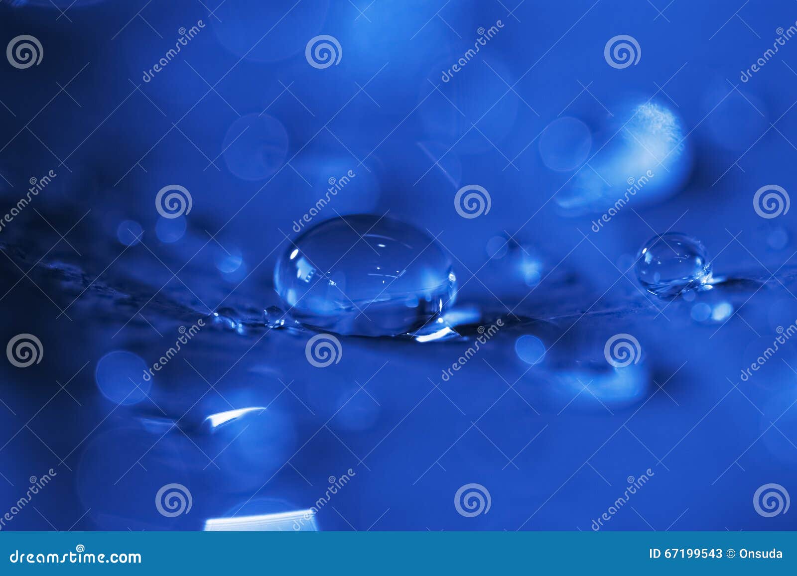 Dew drop on leaf in blue stock image. Image of bokeh - 67199543