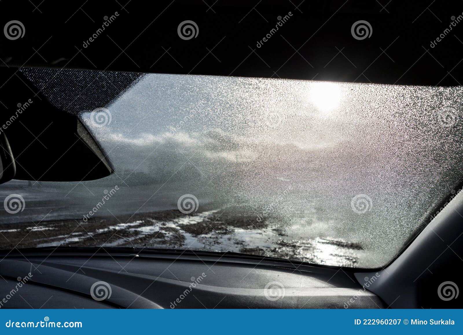 The Dewy Windscreen of a Modern Car and a Dashboard with a Muddy Road ...