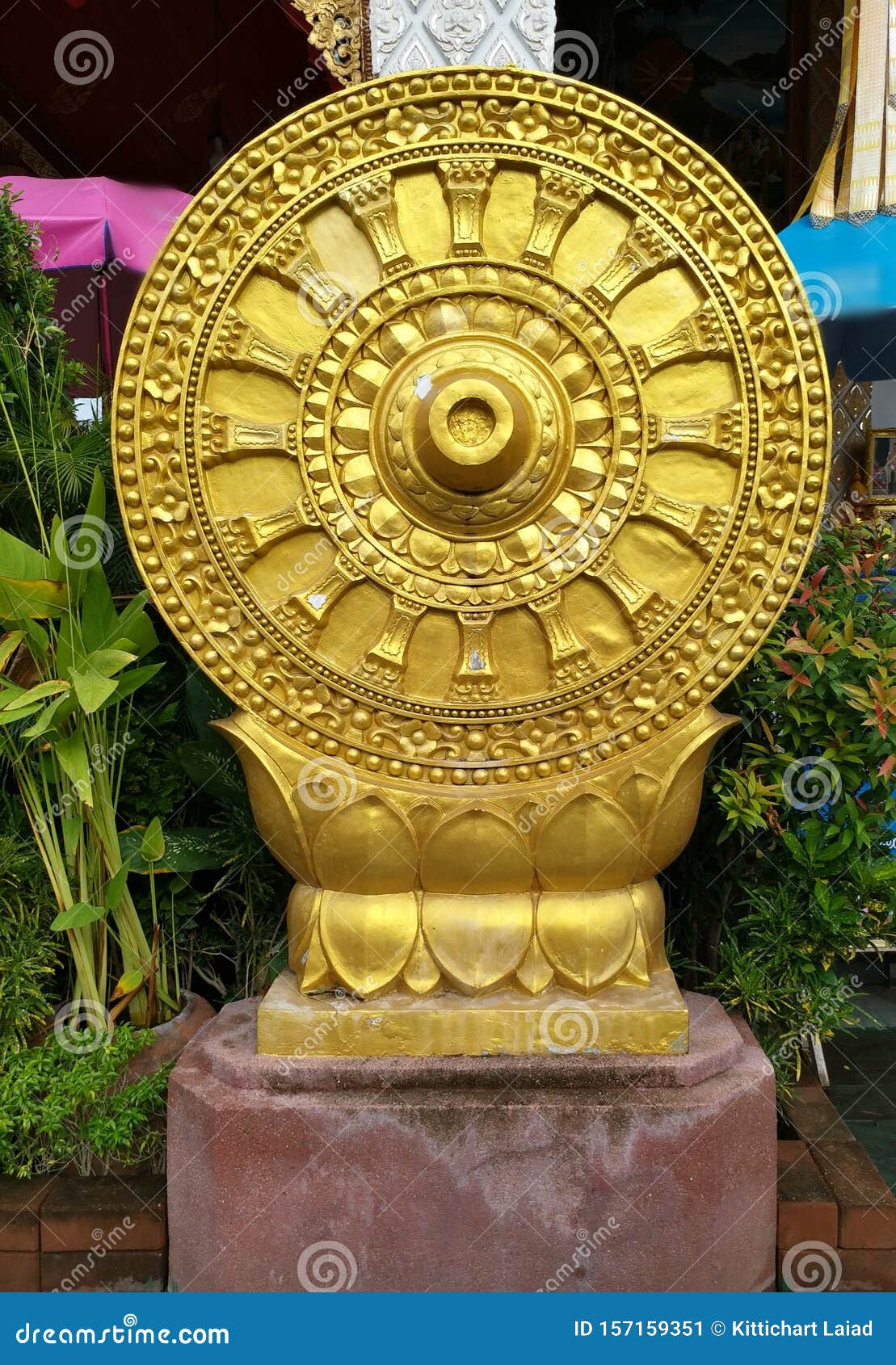 Dharmachakra Symbol And Gold Leaf In The Palm Of The Buddha Statue ...