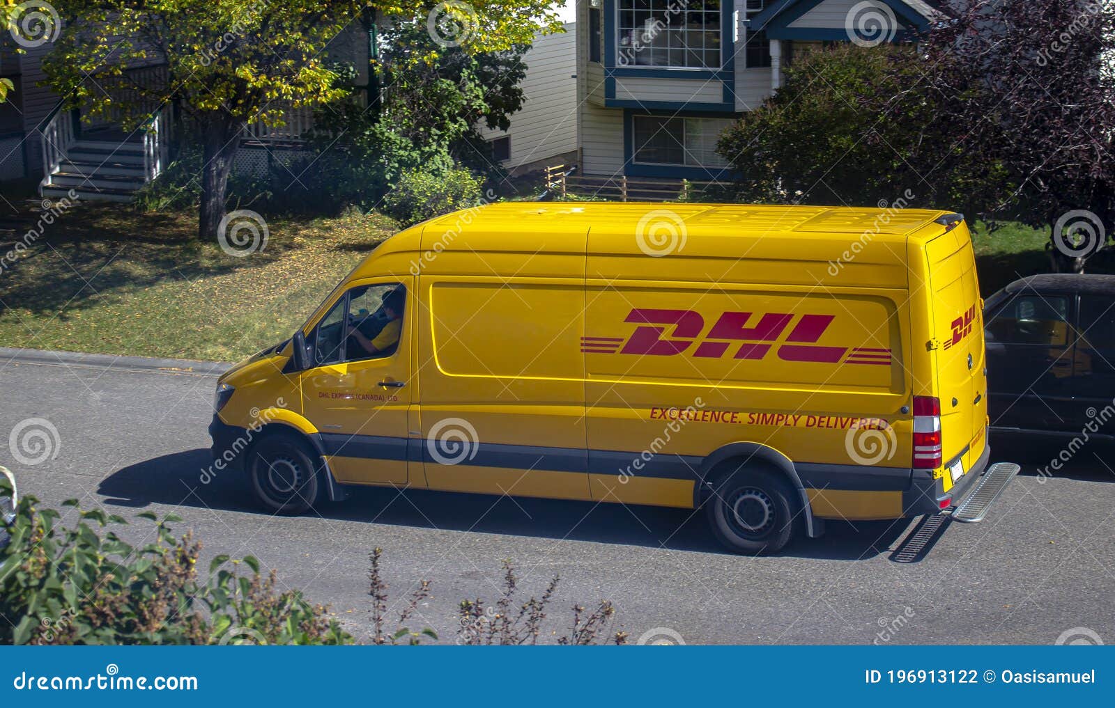 A DHL Worker Driving a Van on a Sunny Day Editorial Photography - Image ...