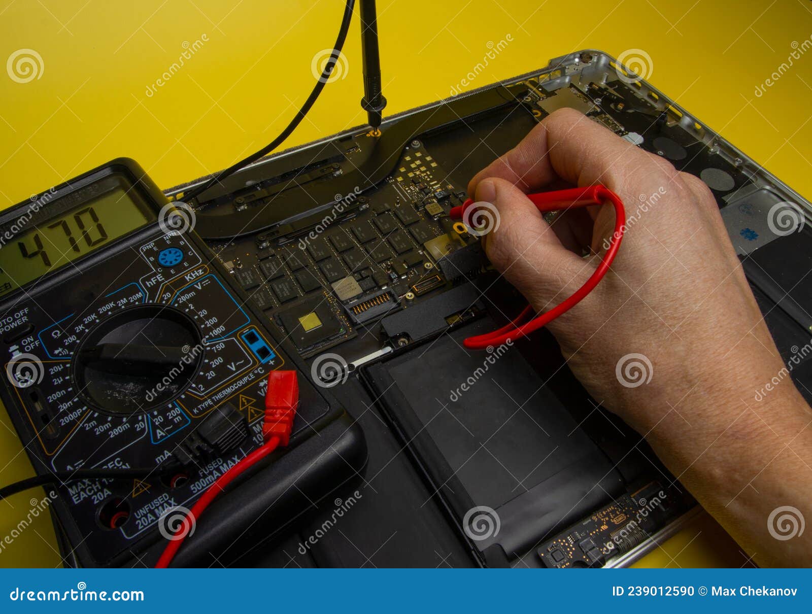 Diagnosing a Computer Motherboard with an Electronic Device Stock Photo ...