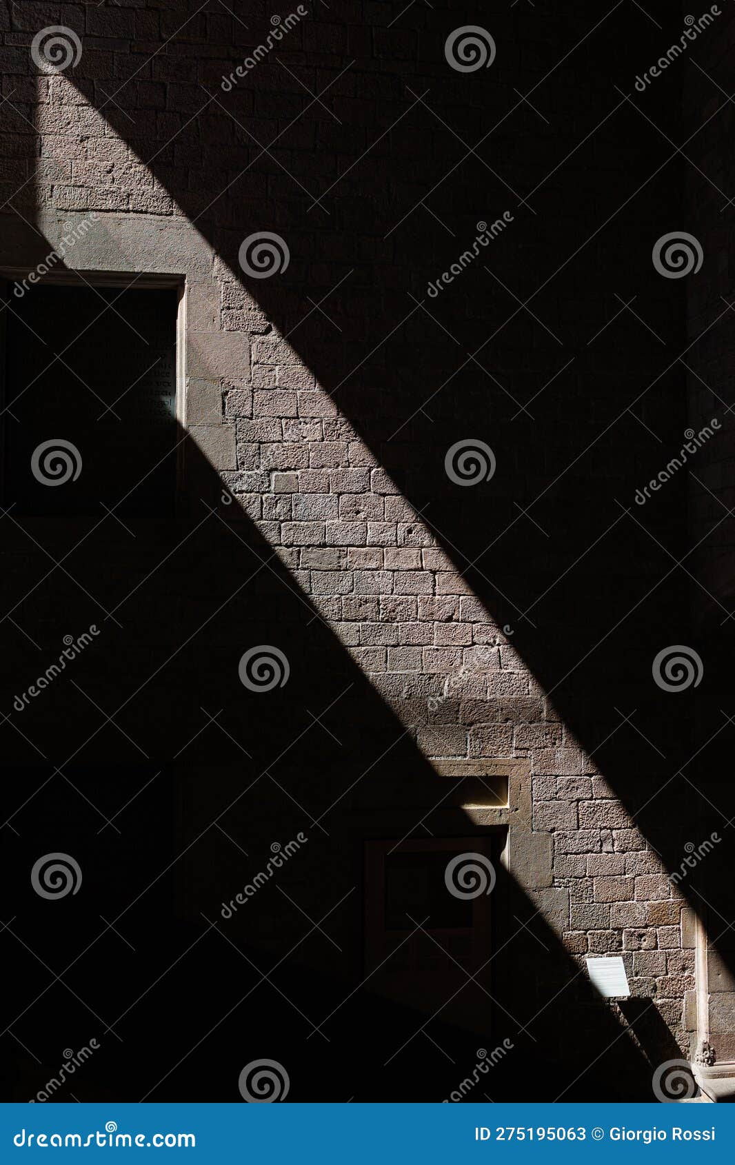 Diagonal Light Beam Passing through a Stone Wall with Windows, Contrast ...