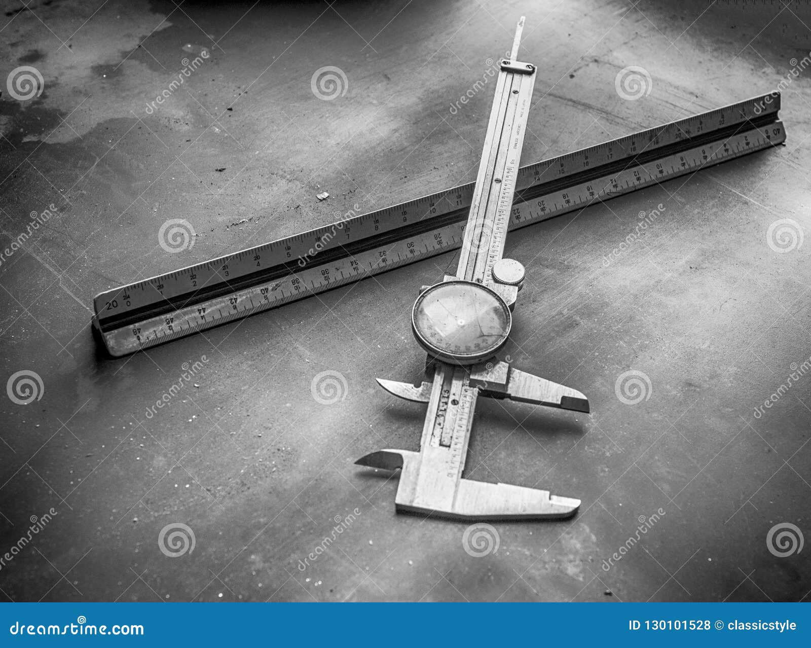Dial Caliper and Ruler on a Machine Shop Steel Bench Stock Photo ...