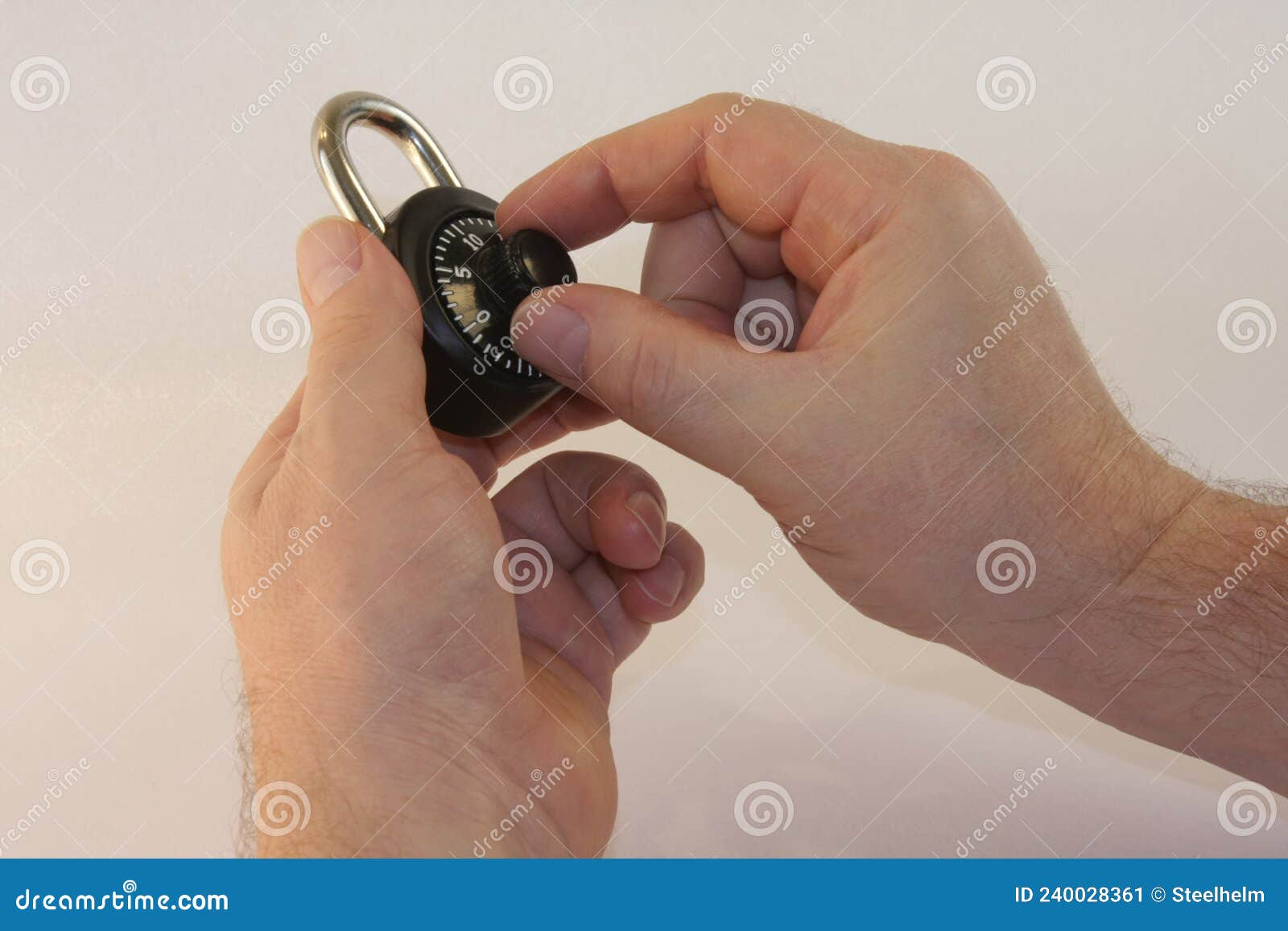 Dialing a Combination Lock for Lockers Using Both Hands Stock Image ...