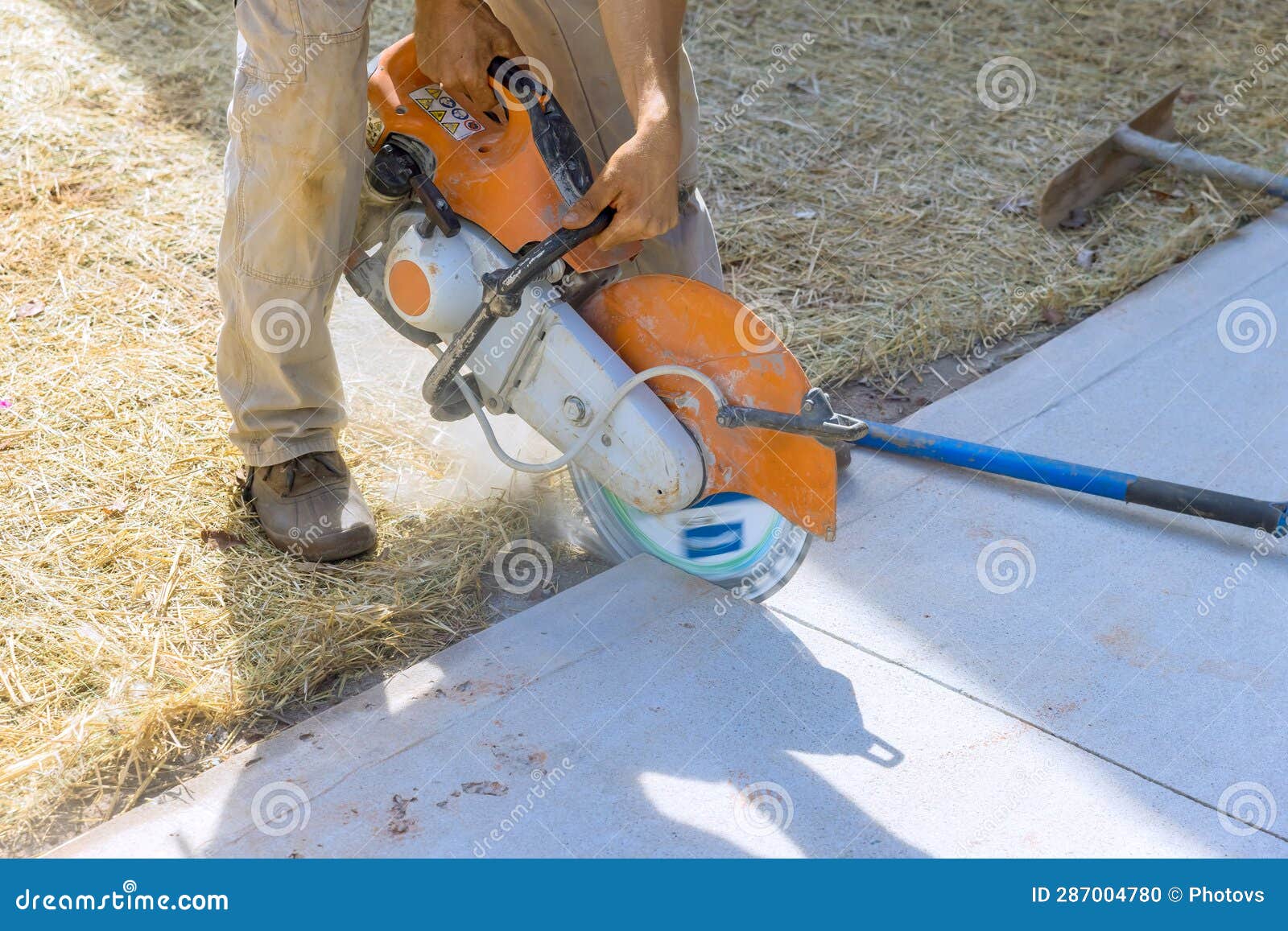 Diamond Blade Saw Mastery. Contractor Worker Cutting Concrete Paving ...
