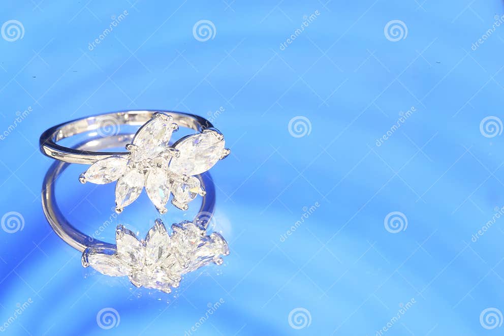 Diamond Ring on Blue Background Stock Image - Image of background ...