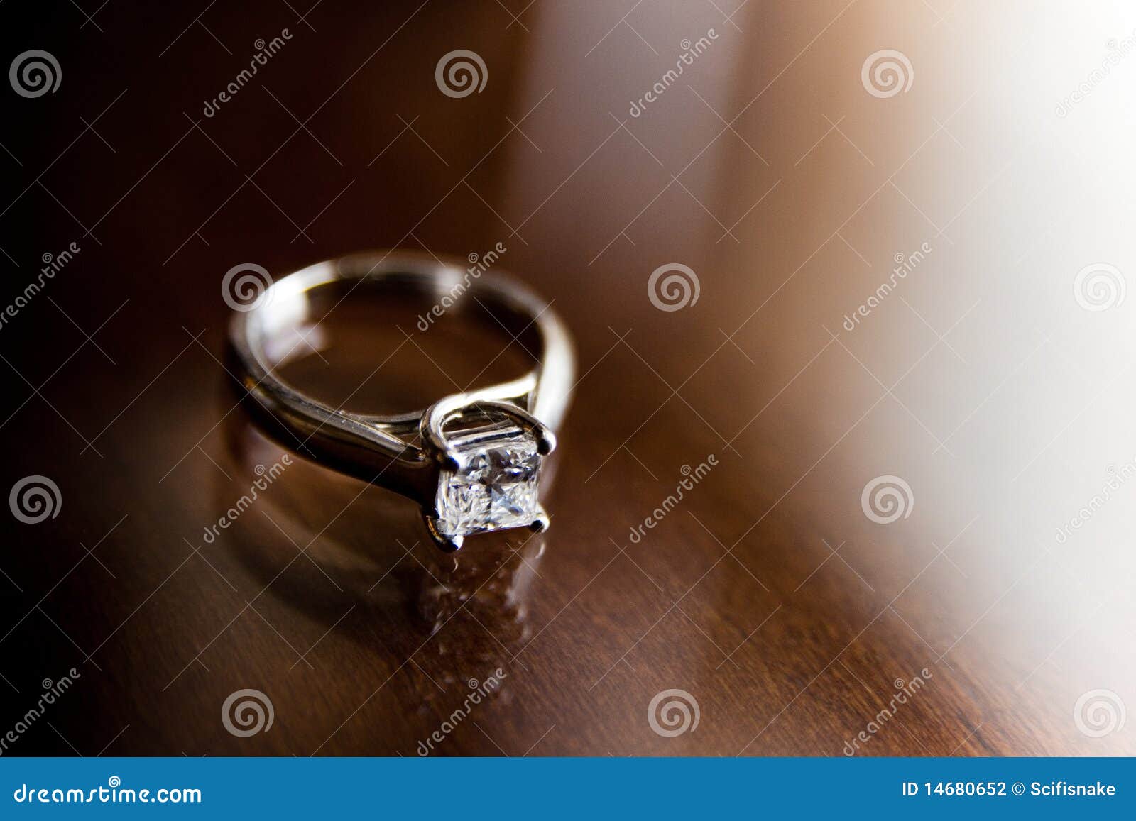 Diamond ring on wood table stock photo. Image of reflection - 14680652