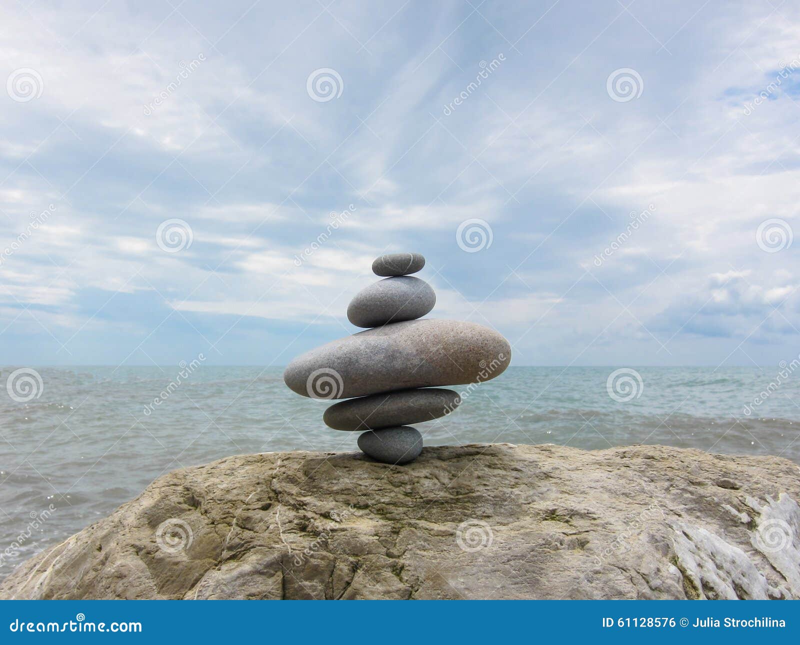 Diamond-shaped Pyramid of Five Stones on a Rock Stock Photo - Image of ...