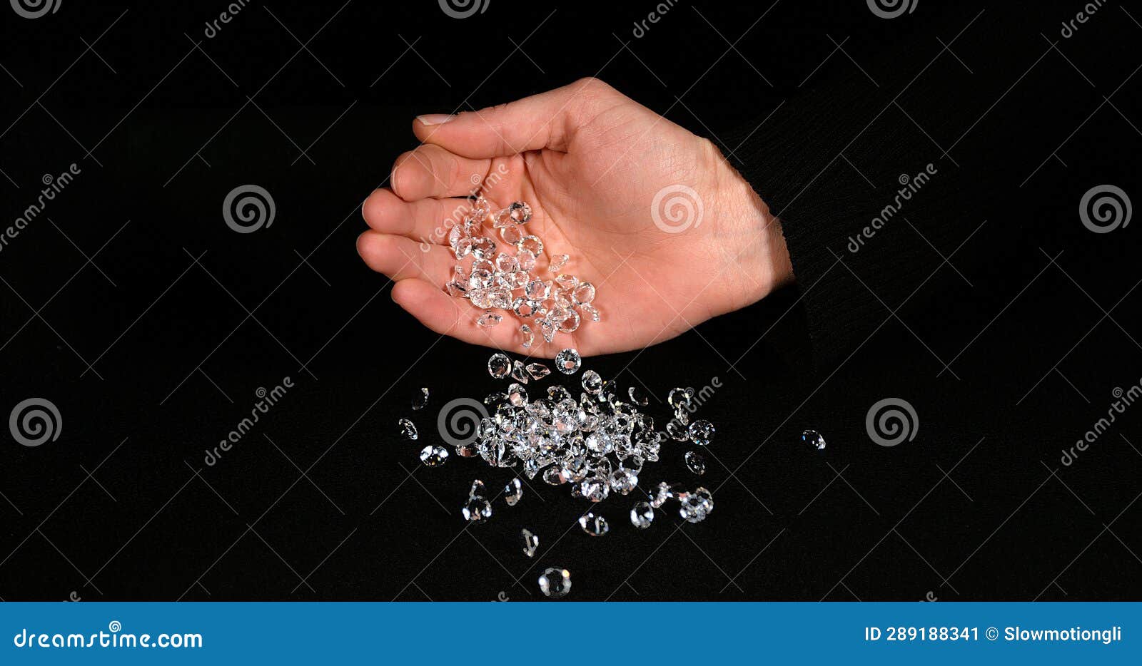 Diamonds Falling into Hand Against Black Background Stock Image - Image ...