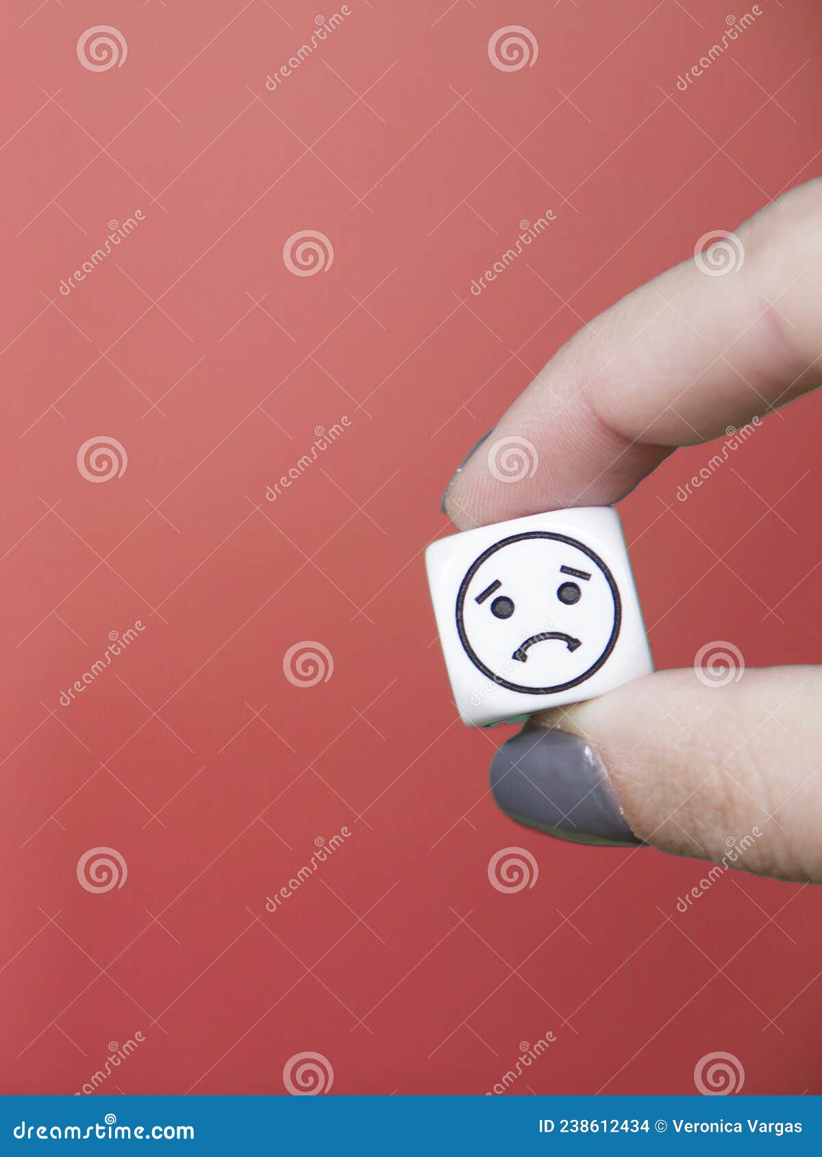 Dice with Sad Face and Red Background. Concept and Emotion Stock Photo ...