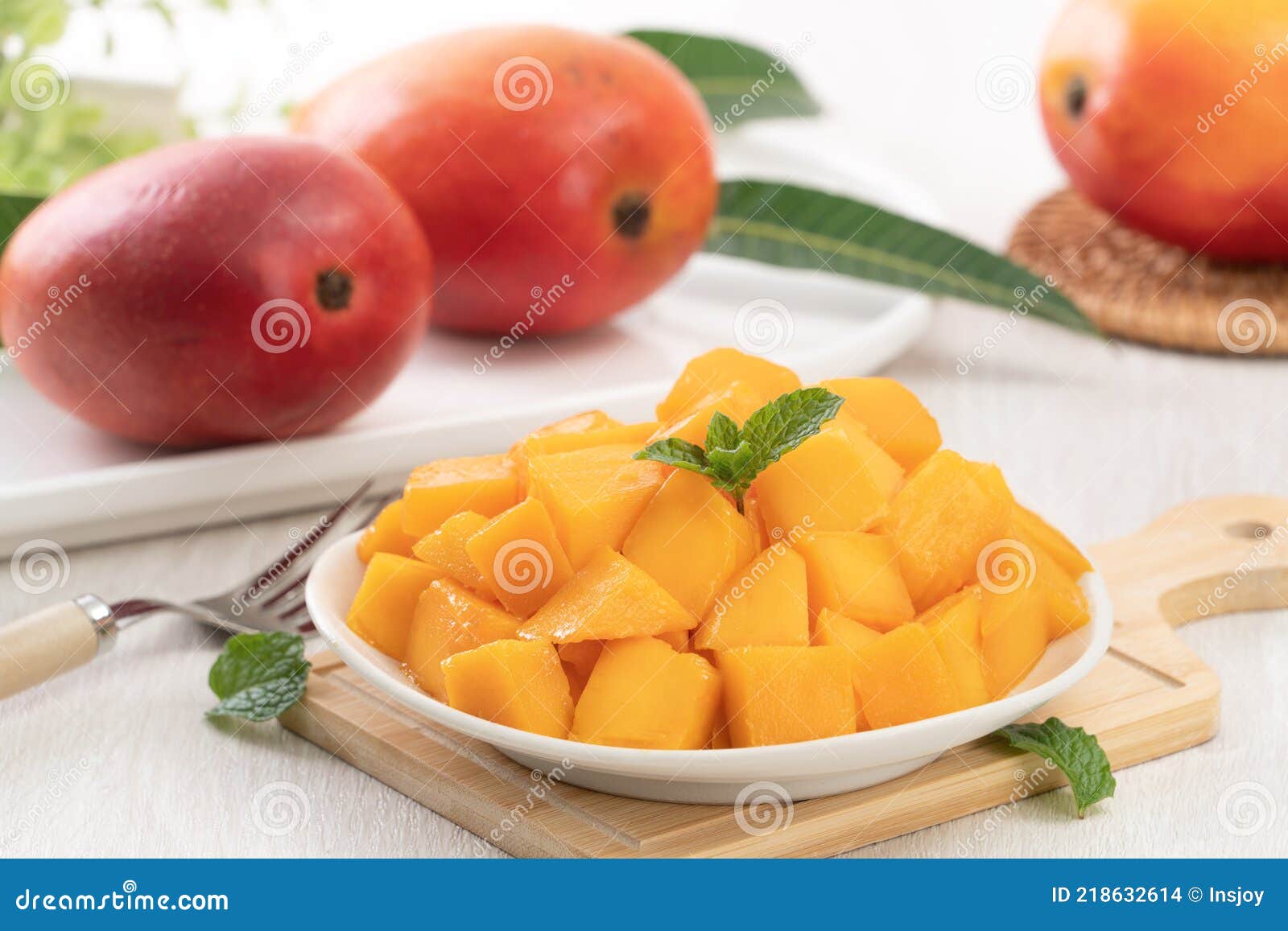 Diced Fresh Mango Fruit on a White Plate with Leaves Stock Photo ...