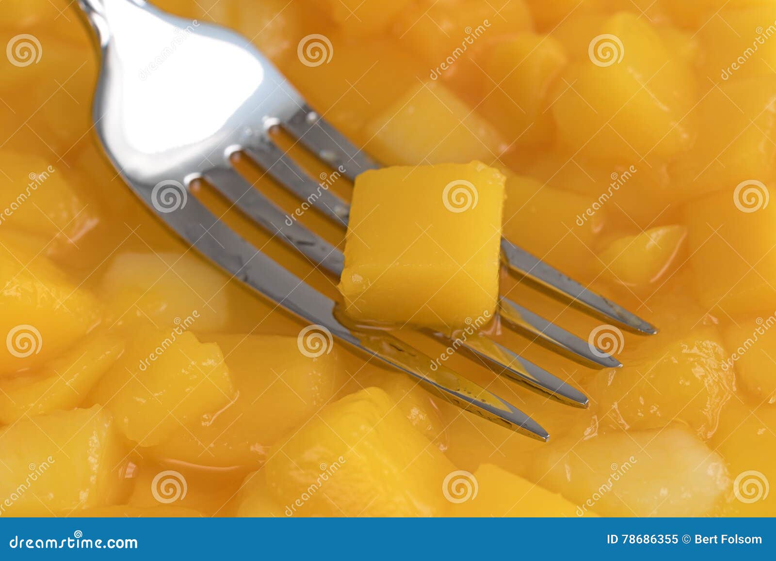 Diced mango on a fork stock image. Image of natural, tropical - 78686355