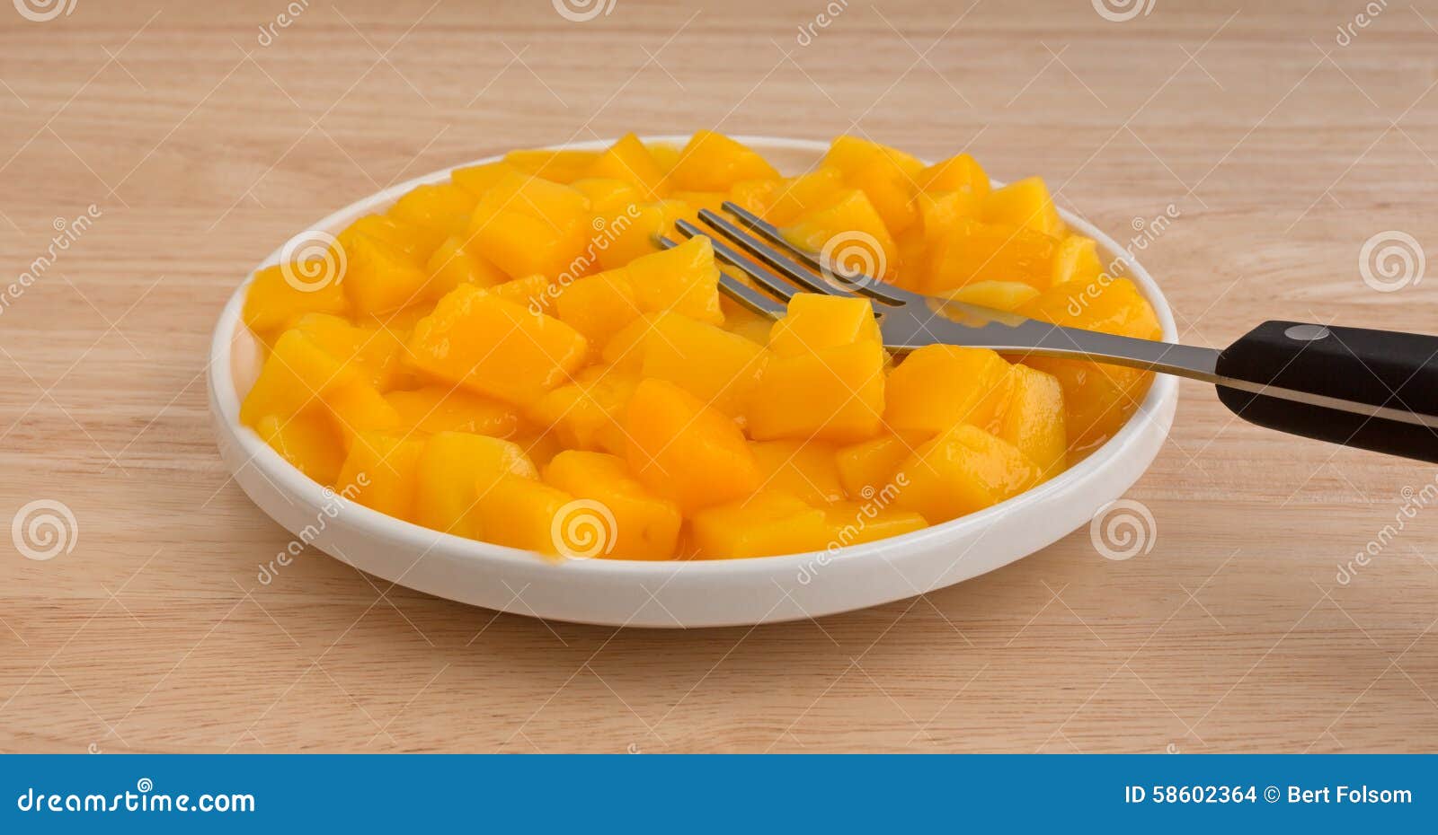 Diced Mangos in a Dish with Fork Stock Photo - Image of processed, fork ...
