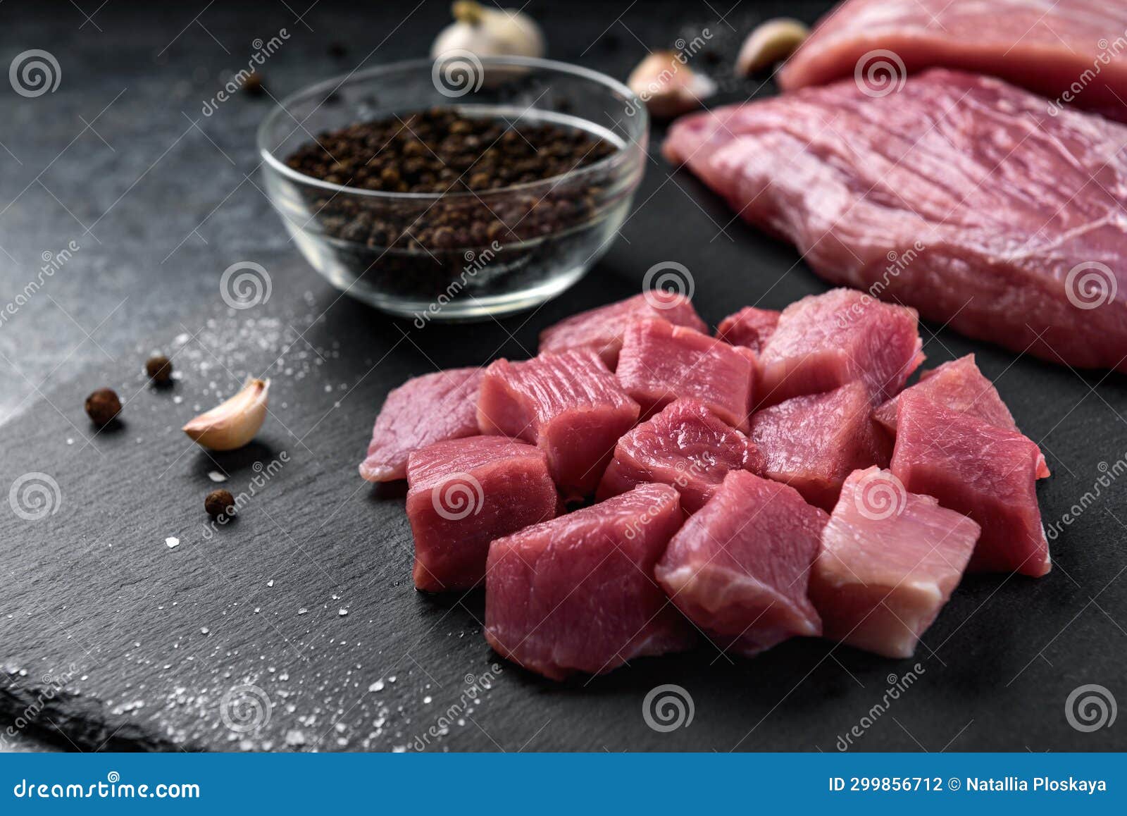 Diced Raw Pork Meat with on Slate Board on Black Background. Stock ...