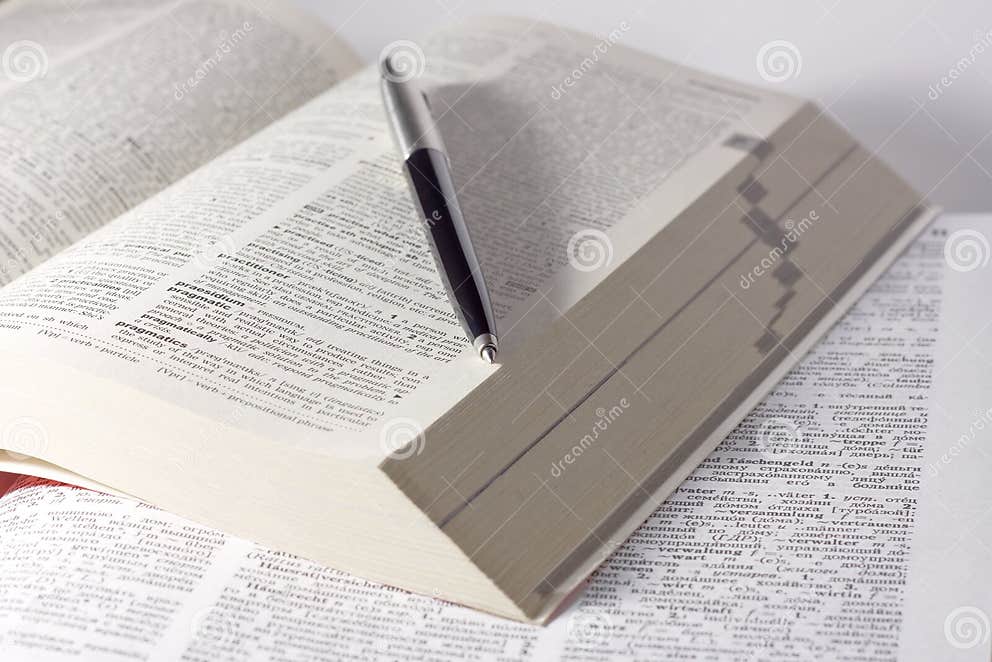 Dictionary with a pen stock image. Image of notebook - 11984009