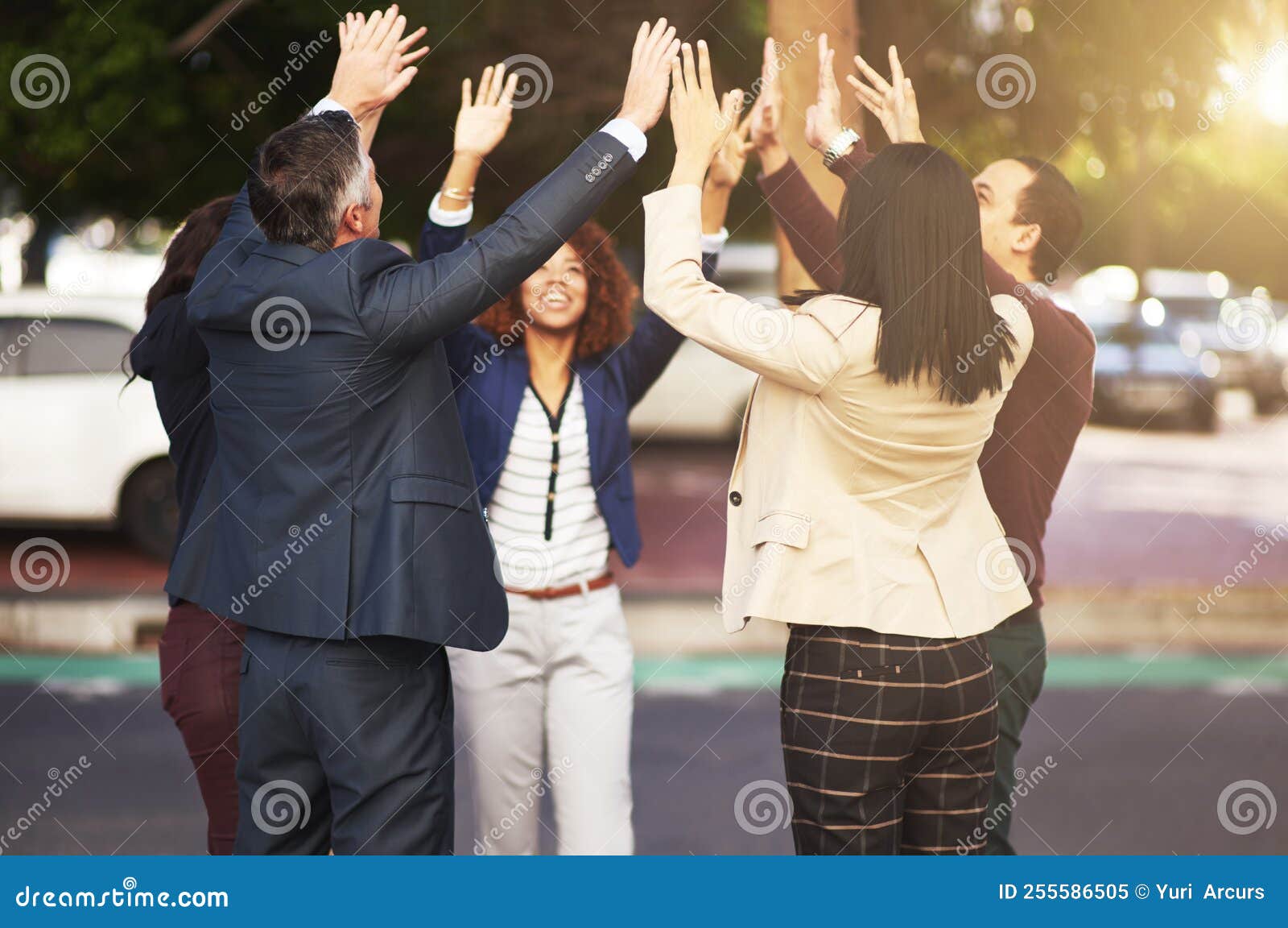We Did it. a Group of Colleagues High Fiving Outside. Stock Image ...