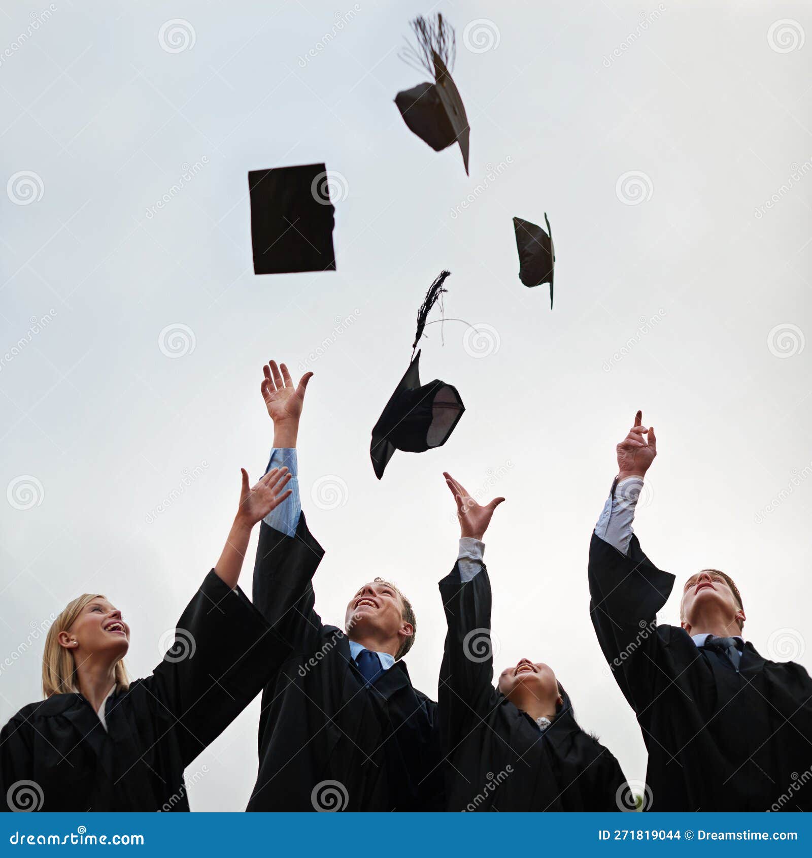 Students Throwing Graduation Caps In The Air Stock Photo ...