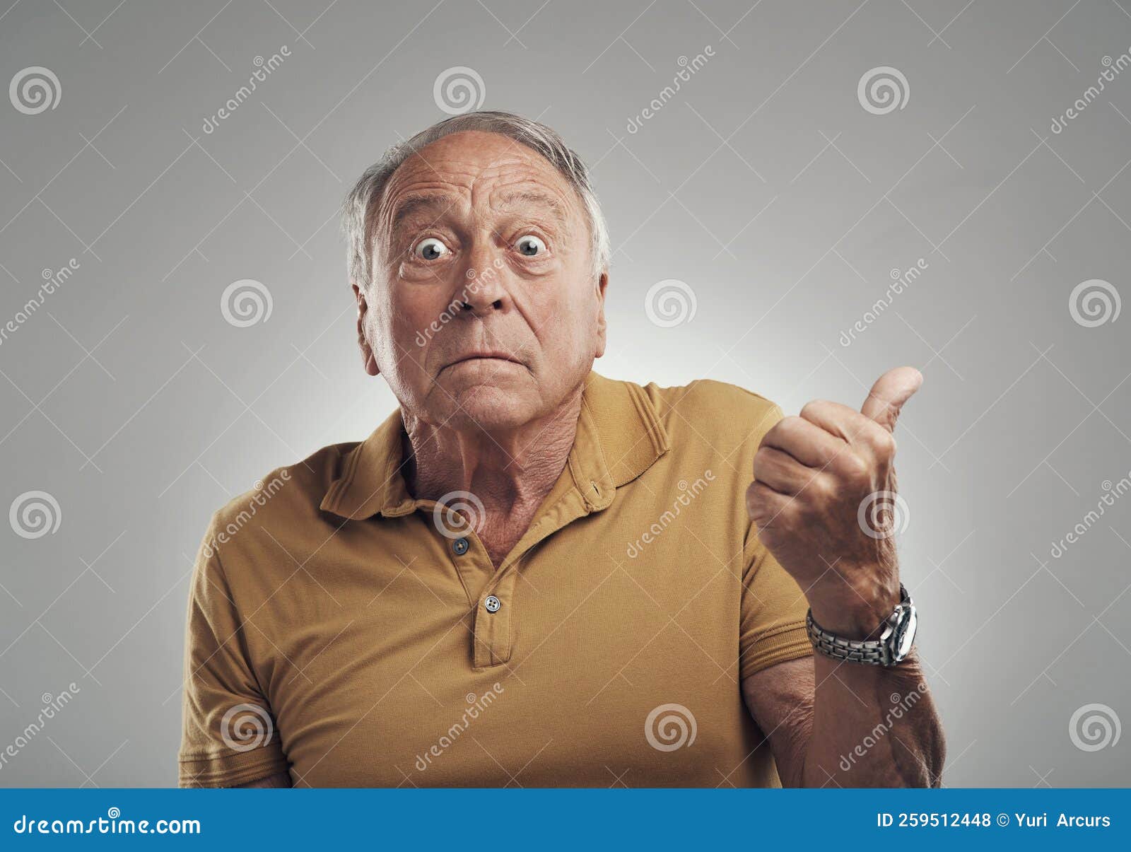 He Did it...Studio Shot of an Elderly Man Pointing in at Something ...