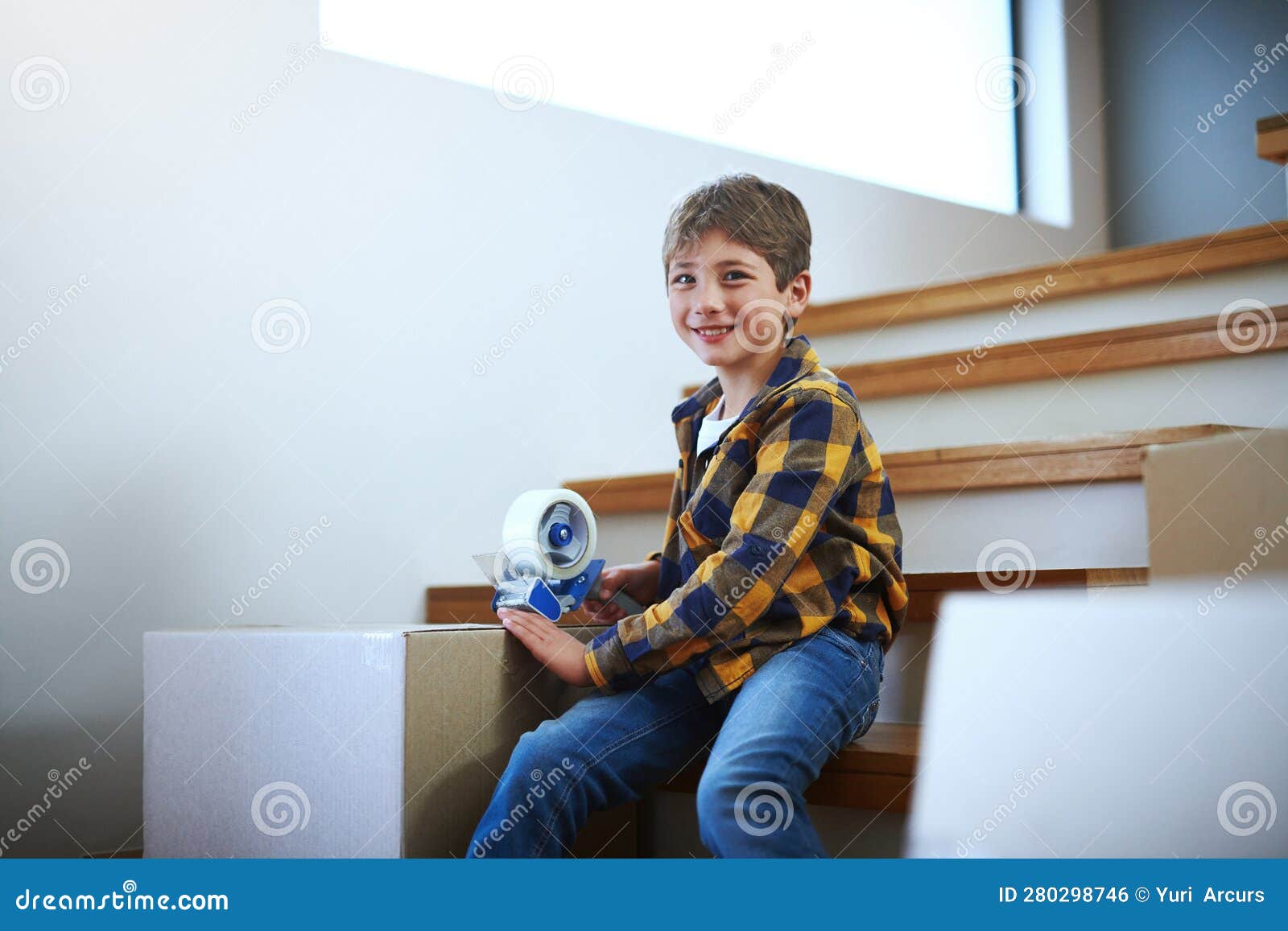 He Didnt Know Packing Would Be so Much Fun. an Adorable Little Boy ...