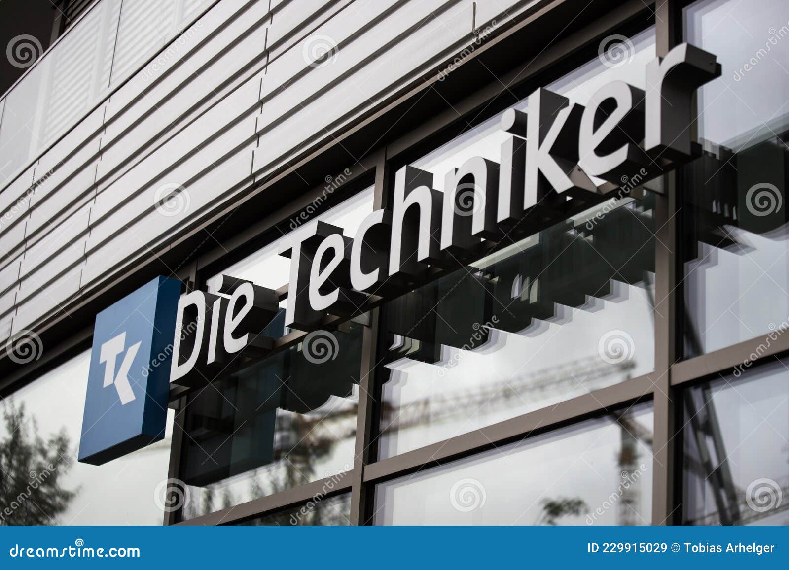 A Die Techniker Sign on a Building Editorial Stock Image - Image of ...