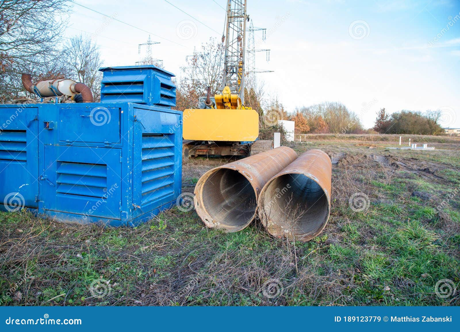 Diesel Aggregate and Large Drill Pipes with Yellow Jib Crane for Well ...