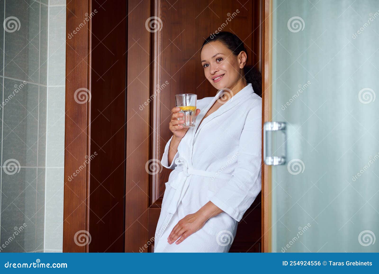 African American Pretty Woman Wearing White Waffle Bathrobe Drinking