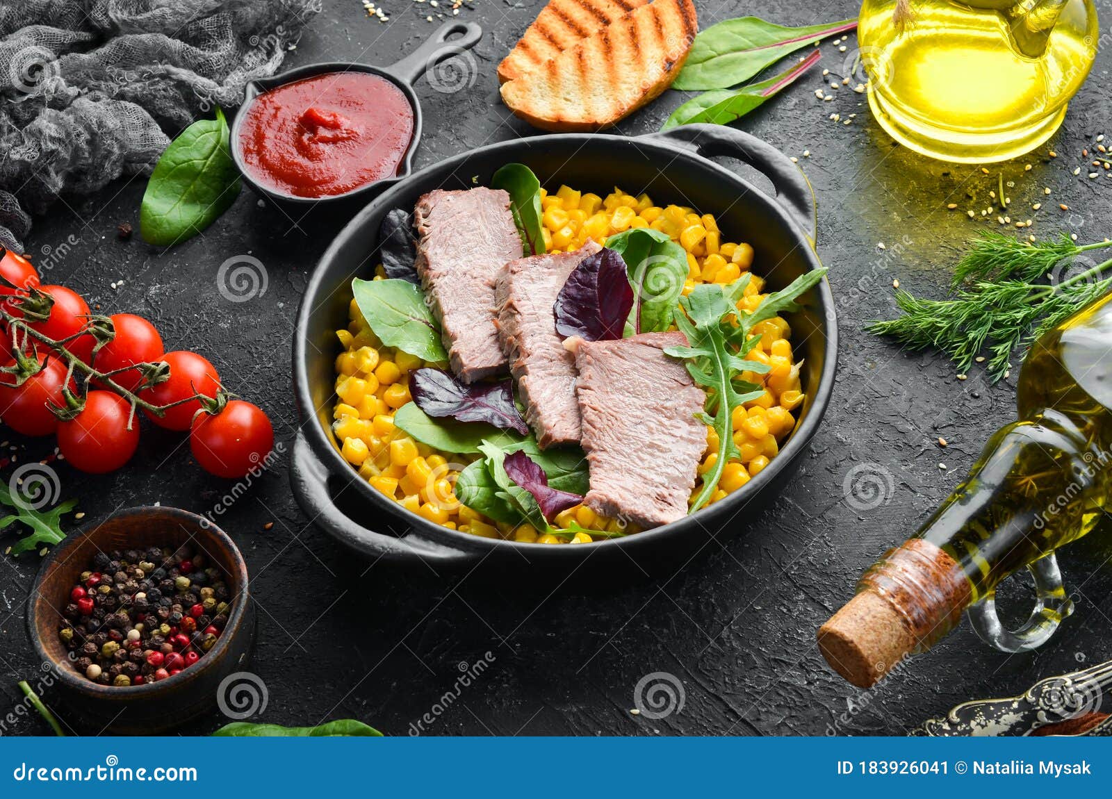 Dietary Nutrition. Boiled Veal with Corn and Spinach in a Black Bowl ...