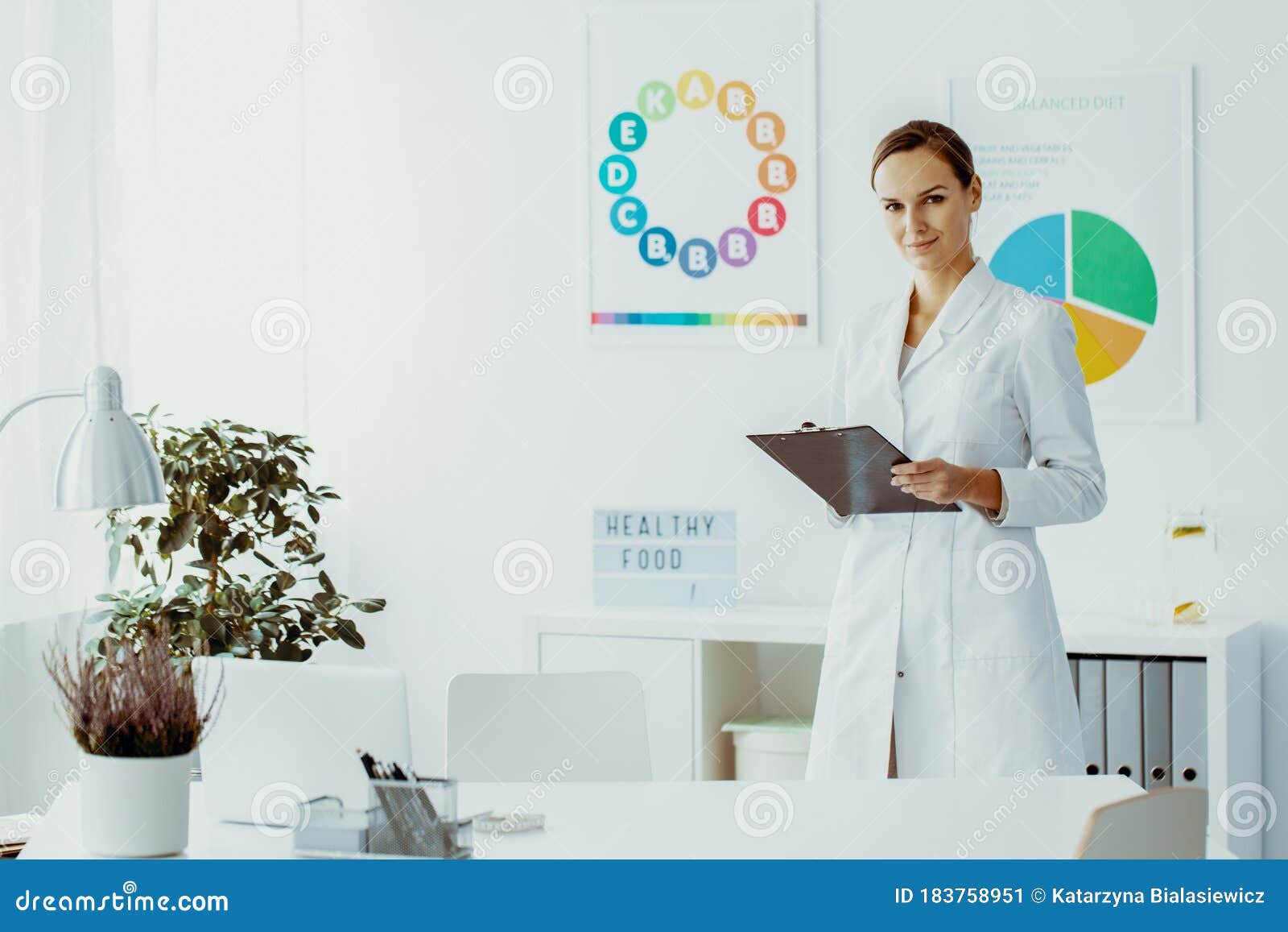 Dietician with Notes and Standing in Her Office Stock Image - Image of ...