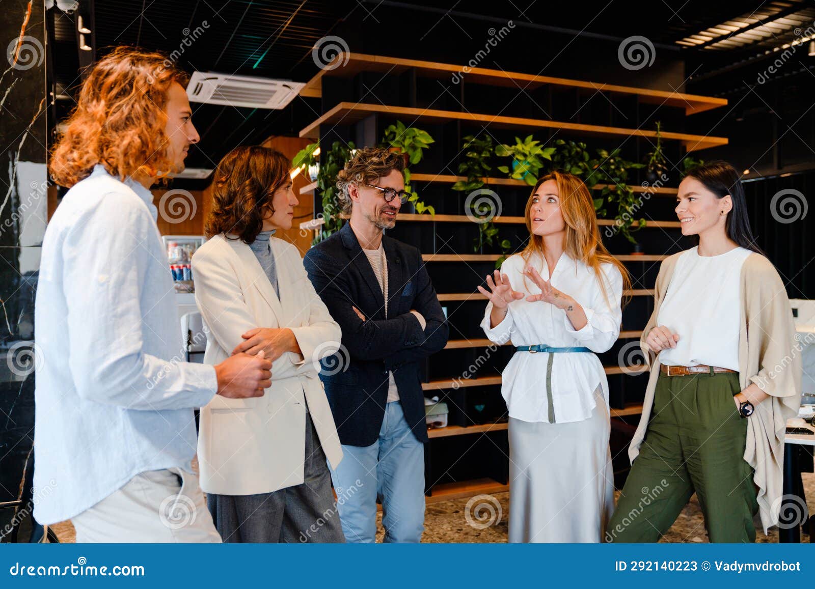 Different Age Colleagues Discussing Their Project during Offline ...