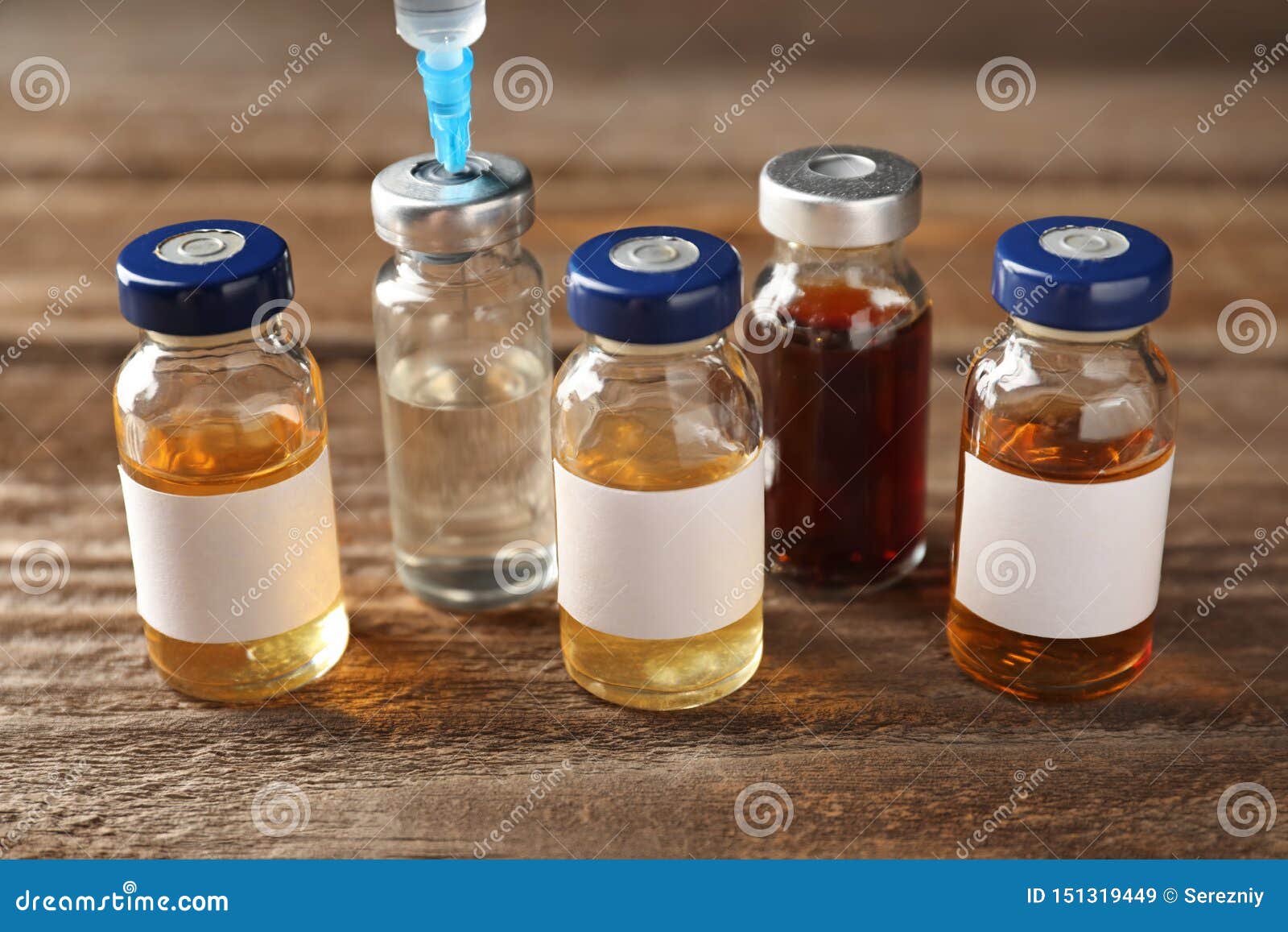 Different Ampules with Syringe on Wooden Table Stock Image - Image of ...