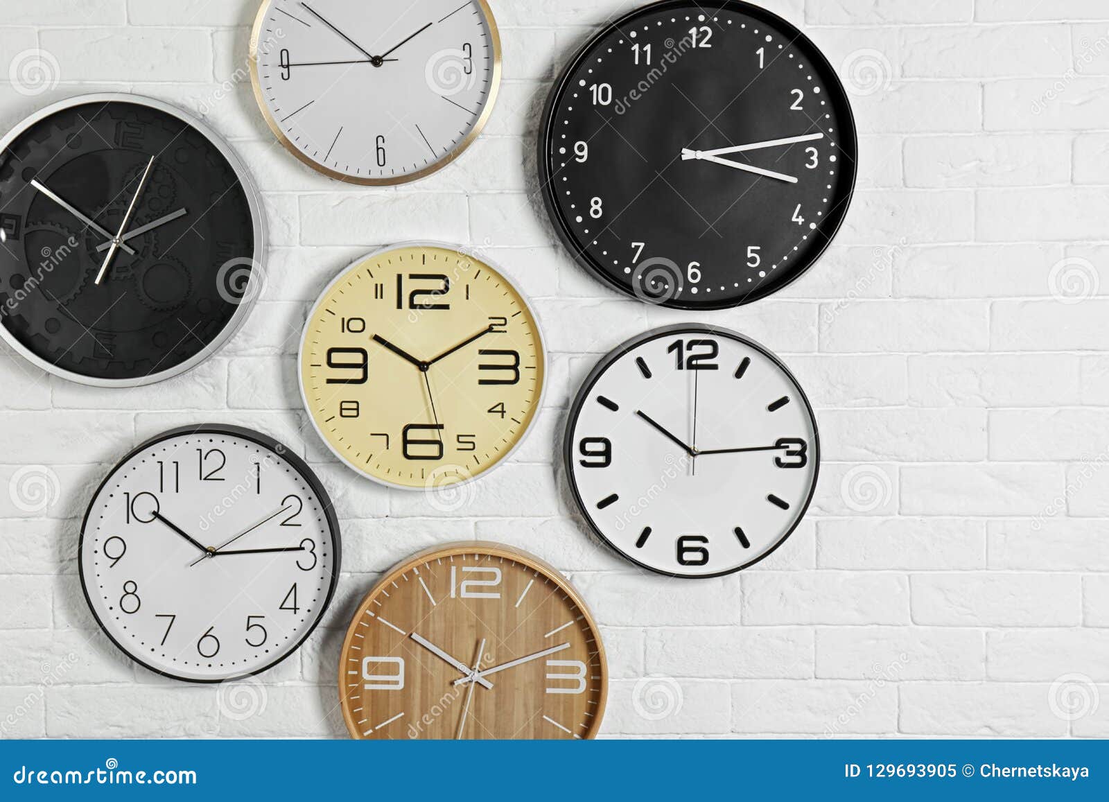 Different Analog Clocks Hanging on White Wall. Stock Image - Image of ...