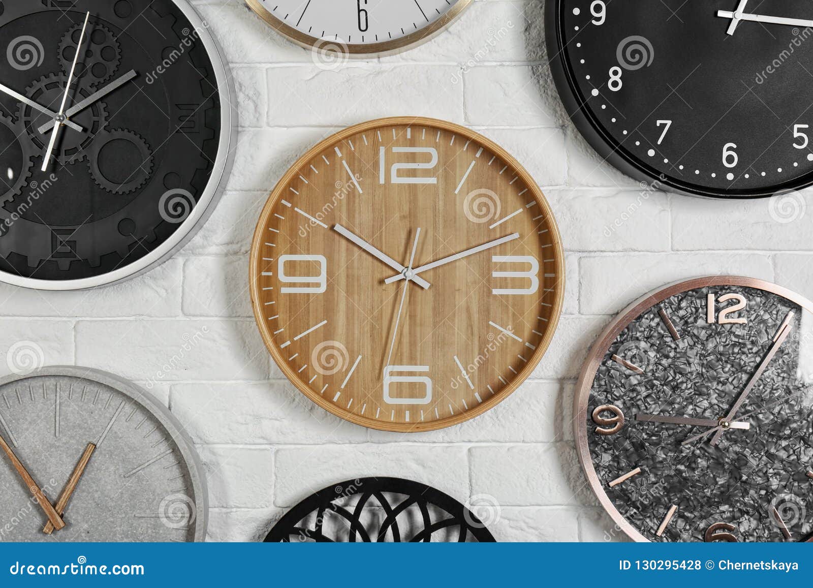 Different Analog Clocks Hanging on White Wall Stock Photo - Image of ...
