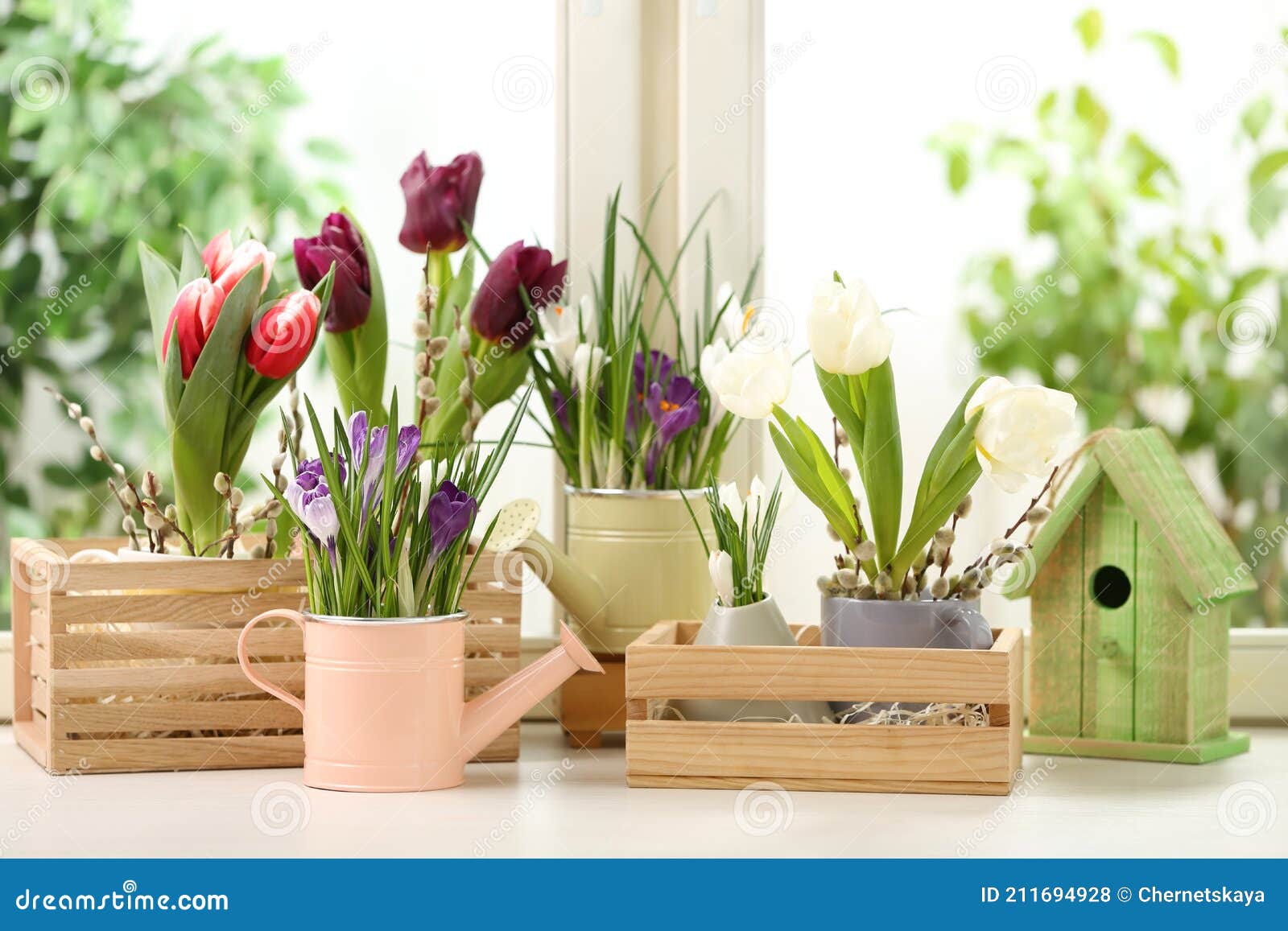 Different Beautiful Spring Flowers with Birdhouse on Window Sill Stock ...