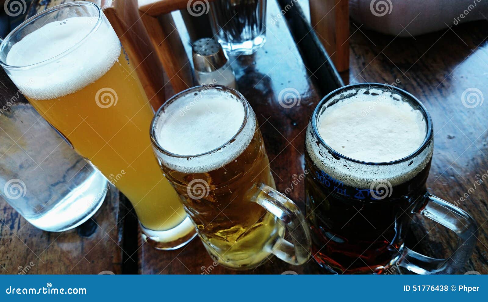 Different beers in a bar stock photo. Image of mugs, beers - 51776438