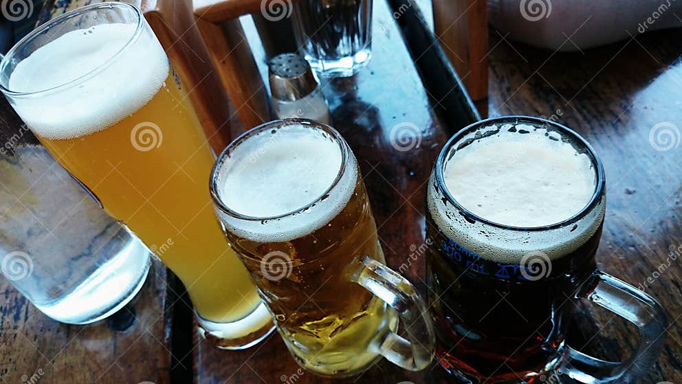 Different beers in a bar stock photo. Image of mugs, beers - 51776438