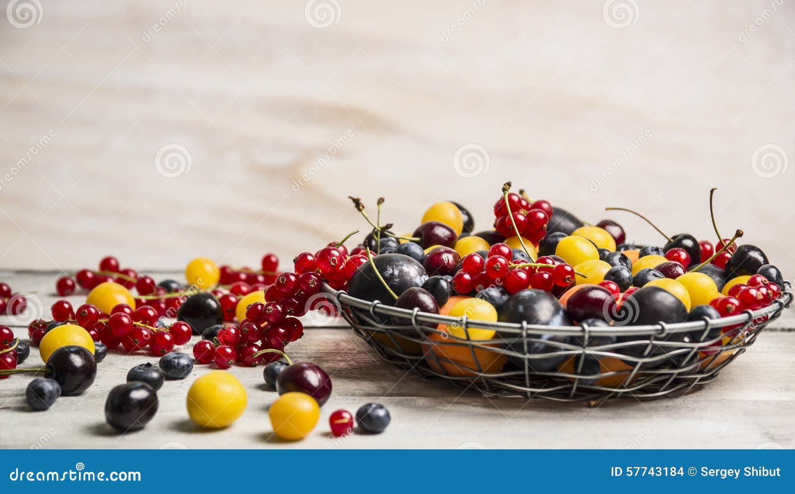 Different Berries in a Basket on a White Wooden Table Stock Photo ...